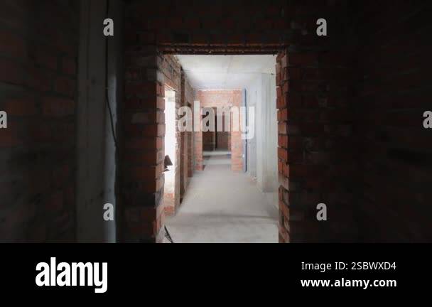 Brick corridor under construction in an unfinished building, Interior ...