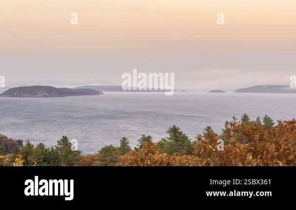 View of Frenchman Bay with fog rolling in from the ocean at sunset in ...
