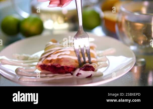 cherry pie fork poke slice open lots of filling cherry strudel with ...