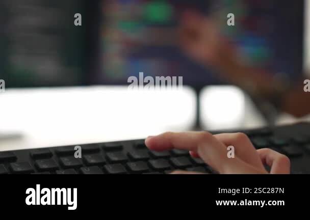 Slow motion closeup hand, back end software developer engineer for computer programming working ...