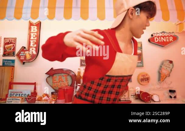 Professional asian restaurant worker dancing and standing behind food ...