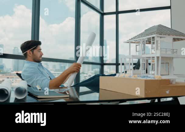 Relaxed professional architect engineer or businessman working ...