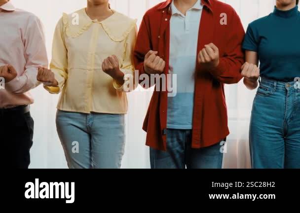 Startup company employee team together raising fist symbolize ...