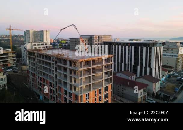 Aerial view of a construction site with a high-rise building under ...