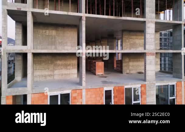 Close-up aerial view of an unfinished high-rise building under ...