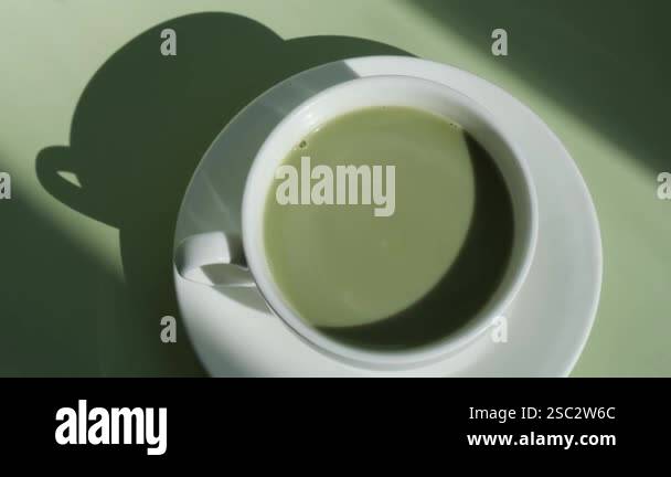 Green latte matcha on pastel background with creative deep shadows ...
