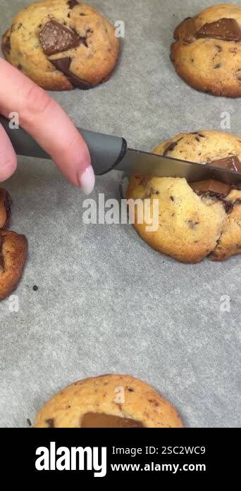 Making and Mixing Chocolate Chip Cookies dough in a transparent glass ...