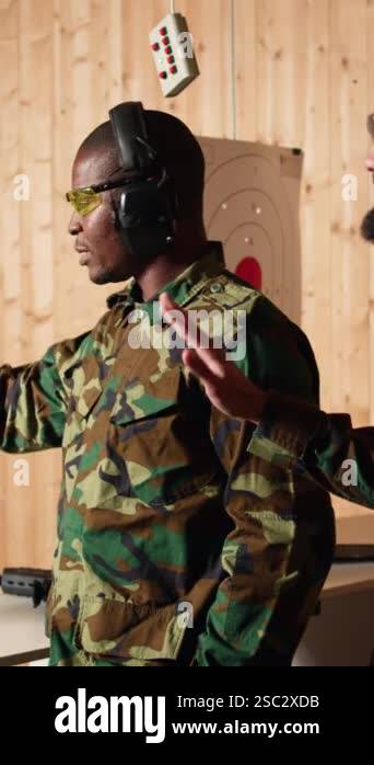 Vertical video Portrait of happy army soldiers in shooting gallery ...