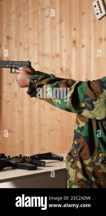 Vertical video Portrait of smiling woman in firing range shooting with ...