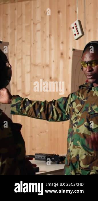 Vertical video Portrait of joyous army soldiers wearing safety gear in ...