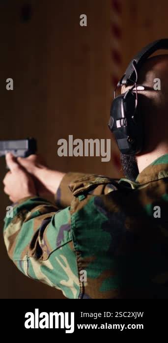 Vertical video Cheerful army unit in firing range shooting targets with ...