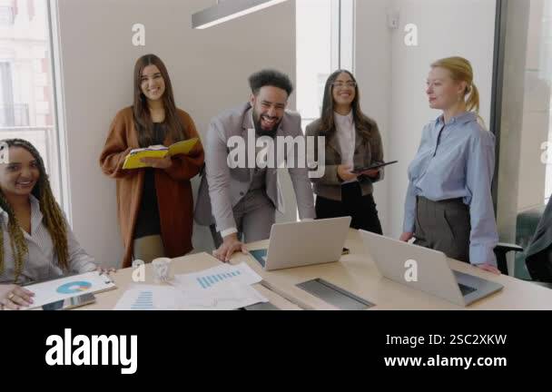 Executive diverse team business people laughing and heaving fun at ...