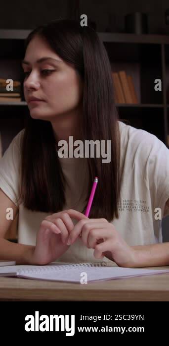 Side view portrait of a brunette student with a discreet smile ...