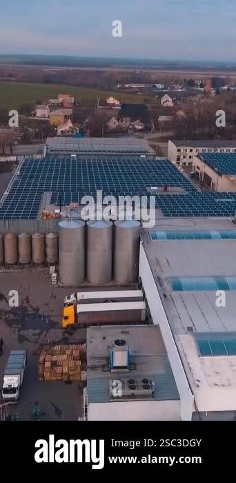 Photovoltaic power plant on roof. Aerial view of factory roof with ...