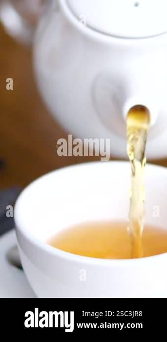 The Simple Elegance of Tea Time Watching a Teapot Pour Tea with Smooth ...