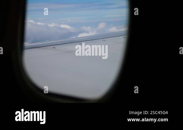 Breathtaking View From Plane Window Showcasing Aircraft Wing and Vast Blue Sky During Serene ...