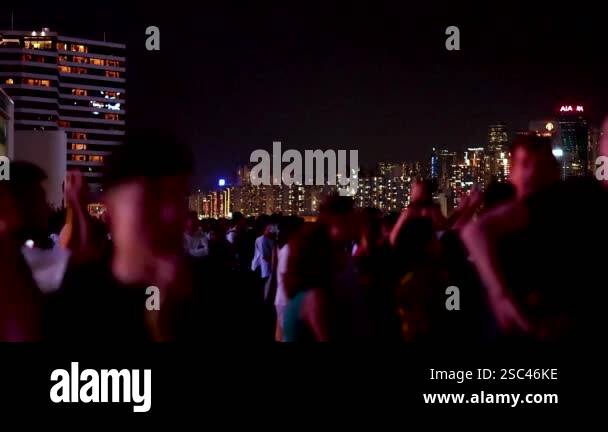 People gather for a nighttime light show Stock Video Footage - Alamy