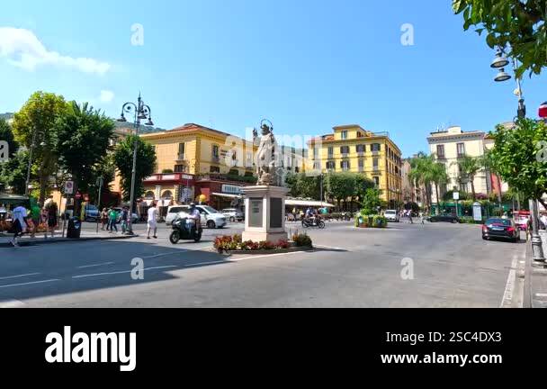 Traffic and pedestrians in a lively square Stock Video Footage - Alamy