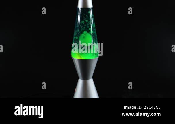 Green lava lamp with moving wax blobs Stock Video Footage - Alamy
