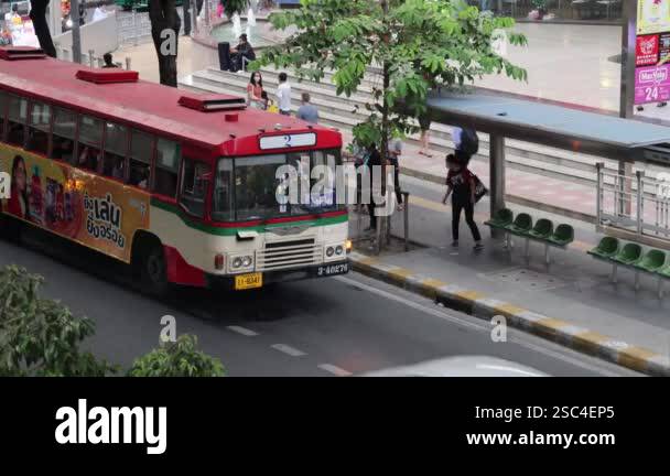 Passengers boarding and alighting a city bus Stock Video Footage - Alamy