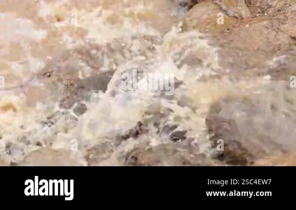 Rapid water movement over rocky surface Stock Video Footage - Alamy
