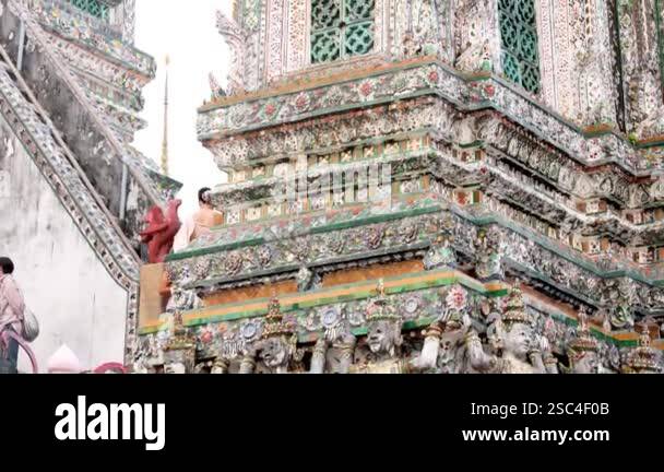 Tourists admire Wat Arun's detailed temple design Stock Video Footage ...