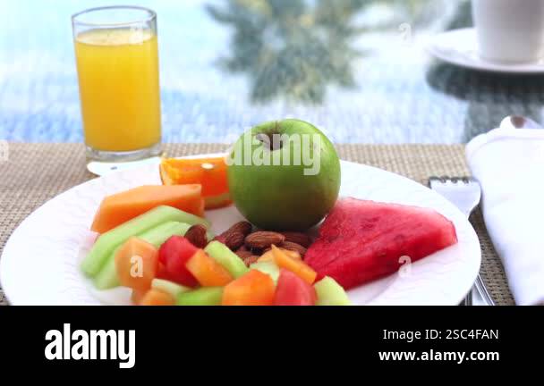 Breakfast served with juicy fruits, nuts, colorful food, refreshing ...