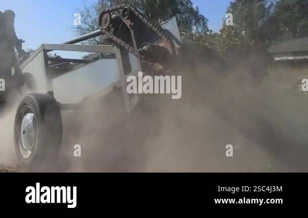 agricultural work on tractor. Mechanized potato processing. potato ...