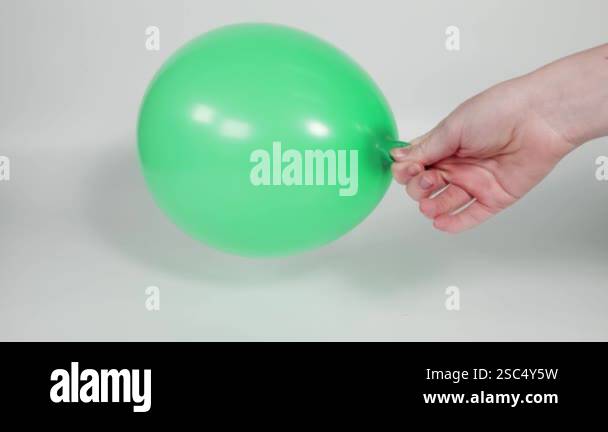 Sequence of inflating and deflating a green balloon Stock Video Footage ...
