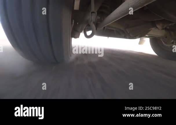 The camera is fixed on the bottom of the car, a view of the wheel and ...