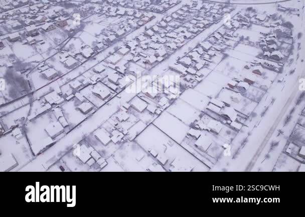 Aerial view of the ukrainian snow village with private houses and ...
