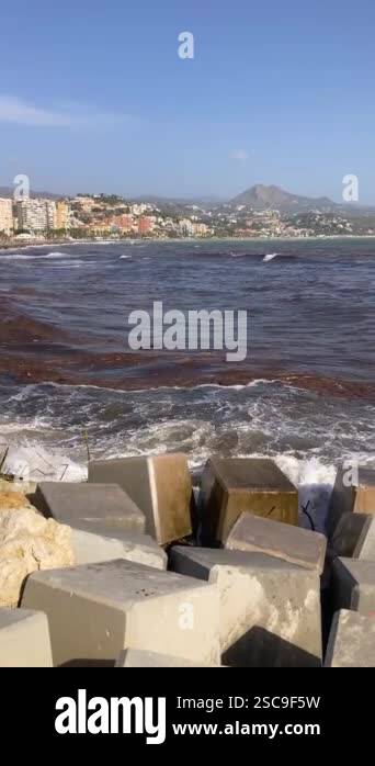 MALAGA, SPAIN - NOVEMBER 15, 2024: Coastal flooding and garbage caused ...