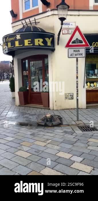 SLOVAKIA, BRATISLAVA - JANUARY 8, 2025: Statue of Man at Workis a work ...