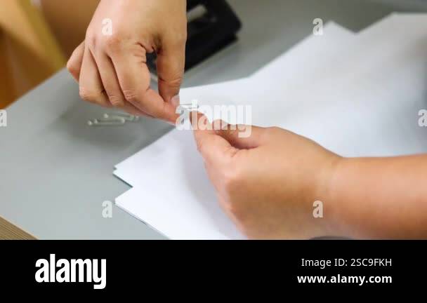 Securing papers Stock Videos & Footage - HD and 4K Video Clips - Alamy