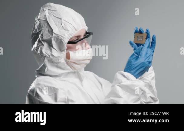 Close-up of a woman engineer holding a next-gen microchip, showcasing ...