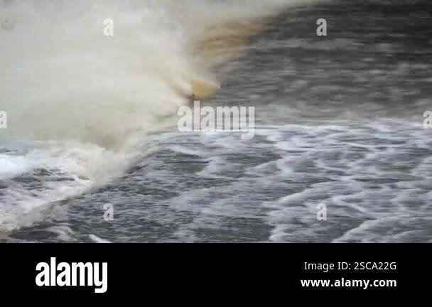 A dramatic scene of fast-moving water forcefully colliding with a ...