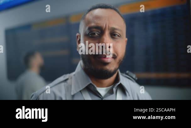 Portrait of African American Security Officer Smiling, Looking at ...
