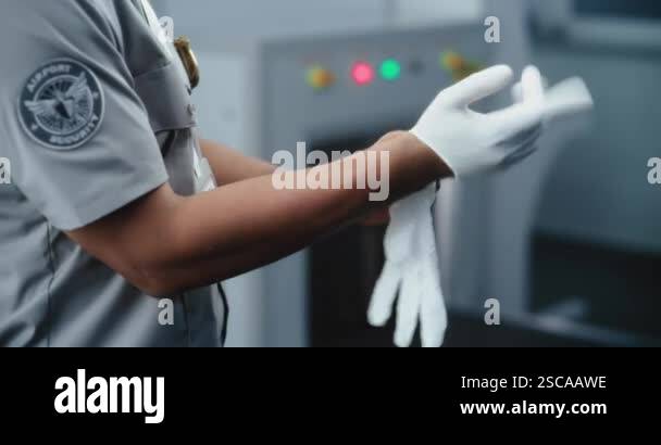 Airport Security Checkpoint: African American Security Officer Putting ...