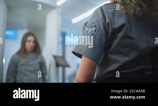 Security Checkpoint in Airport Terminal: Female Security Officer Checks ...