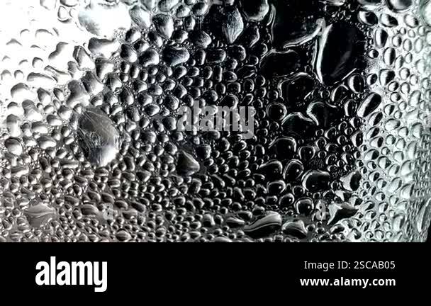 Close-up of water drops on metal surface in high resolution showing ...