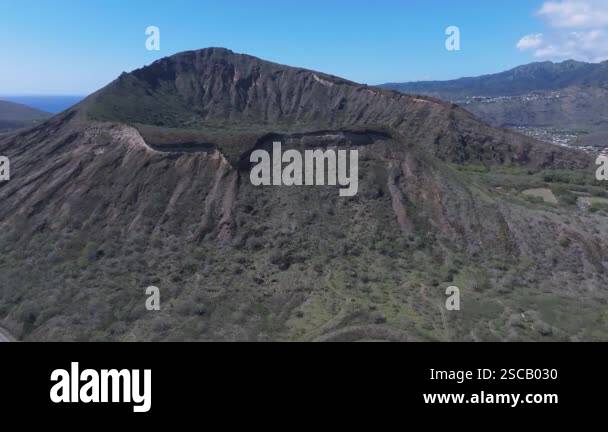 Smooth drone flight circling Diamond Head crater, showcasing rugged ...