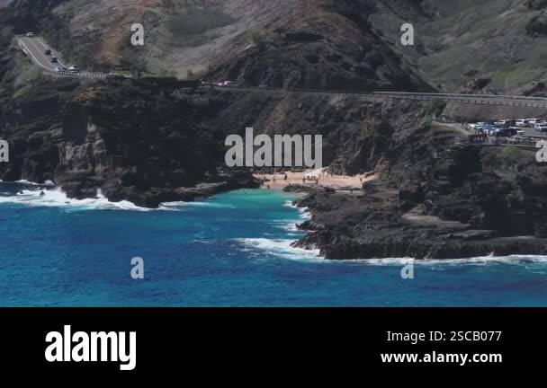 Aerial view of a cliffside on Oahu, Hawaii, with a winding road ...