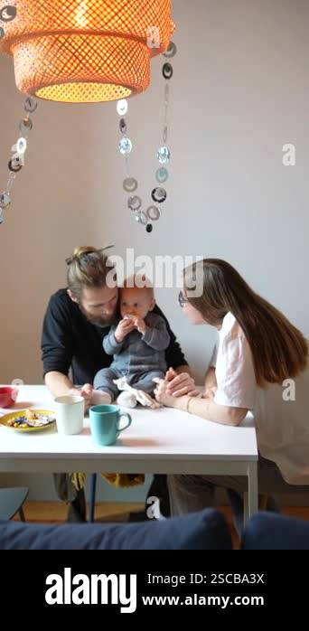 In a warm and cozy home setting, a loving family shares precious ...