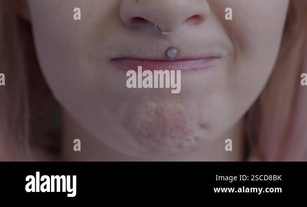 Close-up portrait of nervous and angry woman pursing lips expressing ...
