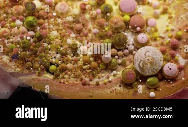 Oil drop paint. Fizzy liquid. Colorful fluid mixing bubble bursting ...