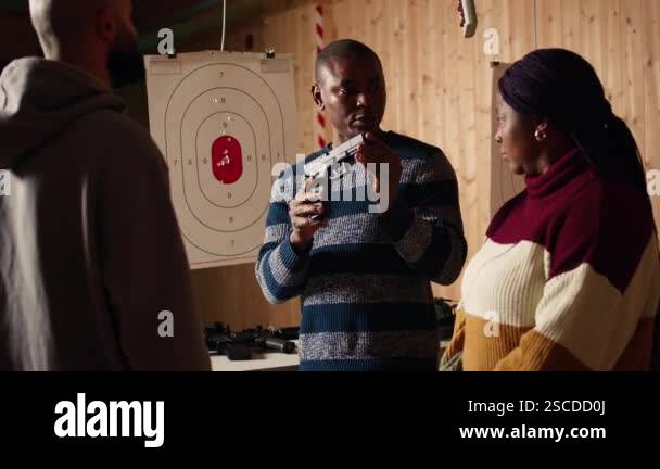 Shooting range safety officer ensuring clients are following ...