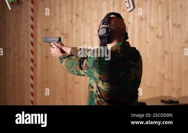 Army soldier in shooting range reloads pistol, shooting target, testing ...