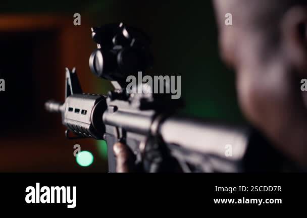 Man holds assault rifle, enjoying recreational shooting experience in ...