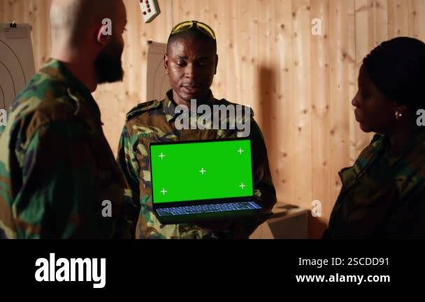 Team of military units at shooting range watching video on isolated ...