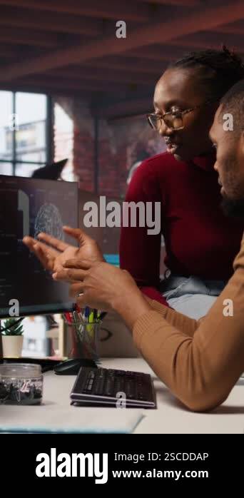 Vertical video Team of startup admins doing brainstorming, working with machine learning tech ...
